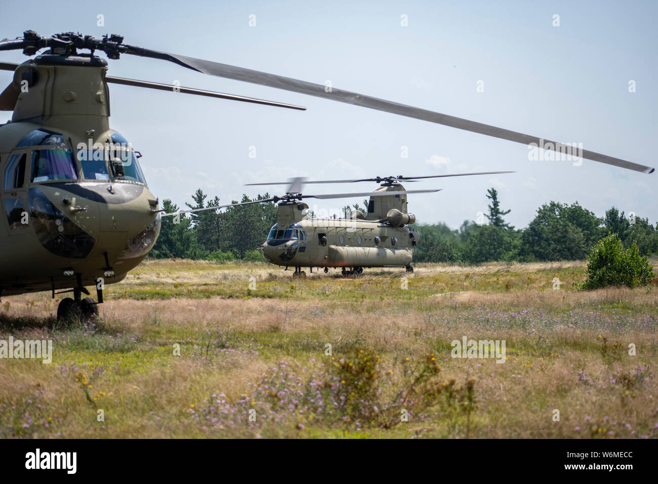 Two CH47F Chinooks being prepped for sling load training at Fort Drum ...