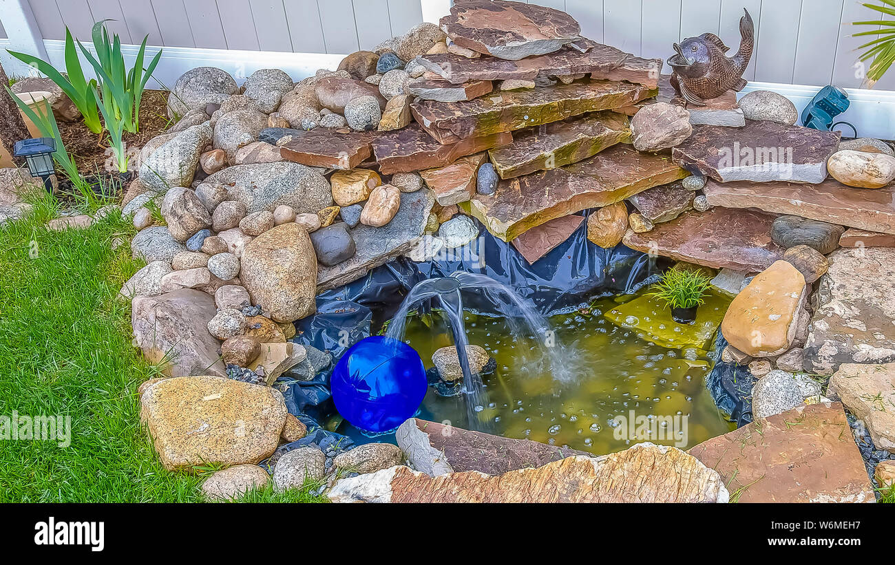Panorama frame Fountain with rocks of different shapes and sizes at the ...