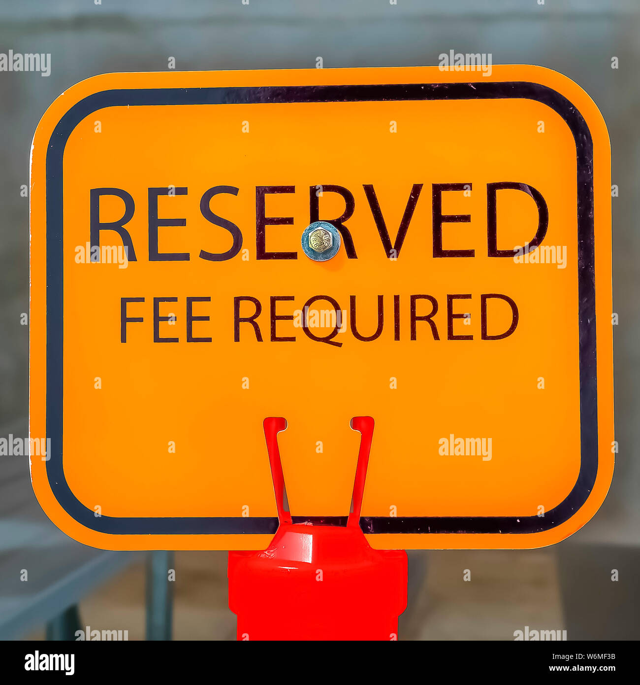 Square frame Close up of an orange Reserved sign with tables and ...