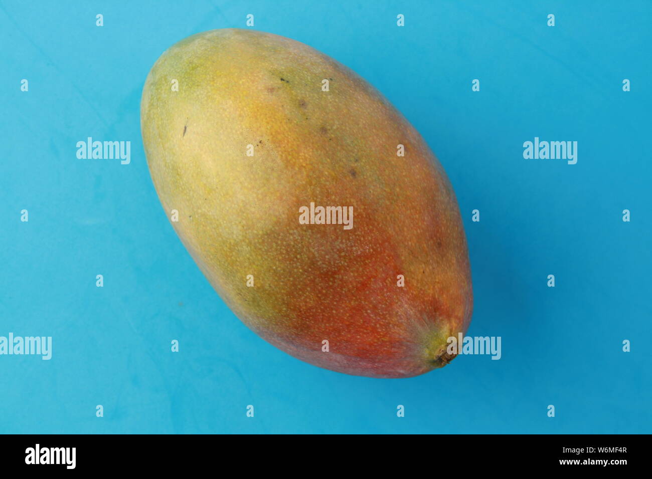Delicious mango in colorful background Stock Photo - Alamy