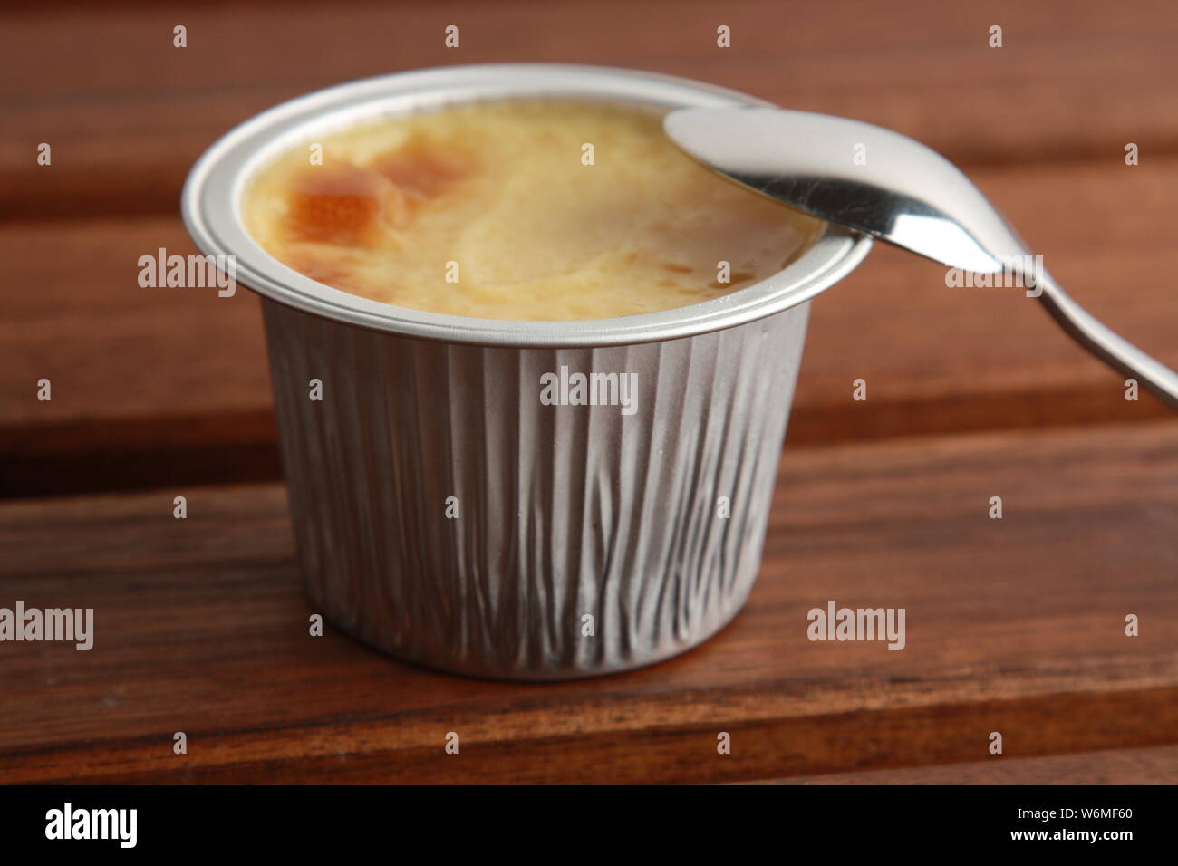 delicious egg flan in aluminum container Stock Photo - Alamy
