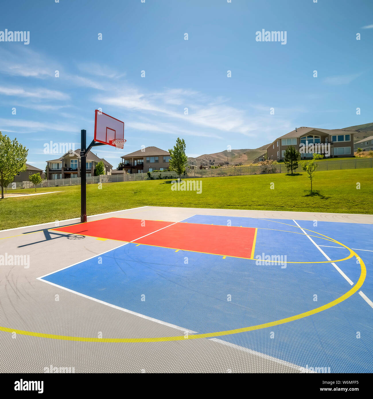 Square frame Outdoor public basketball court with home mountain and ...