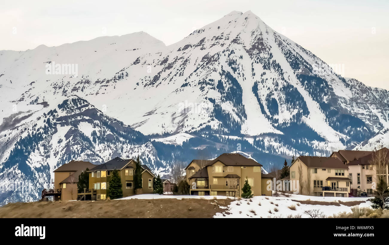 Panorama Homes built on a hill with view of striking mountain covered ...