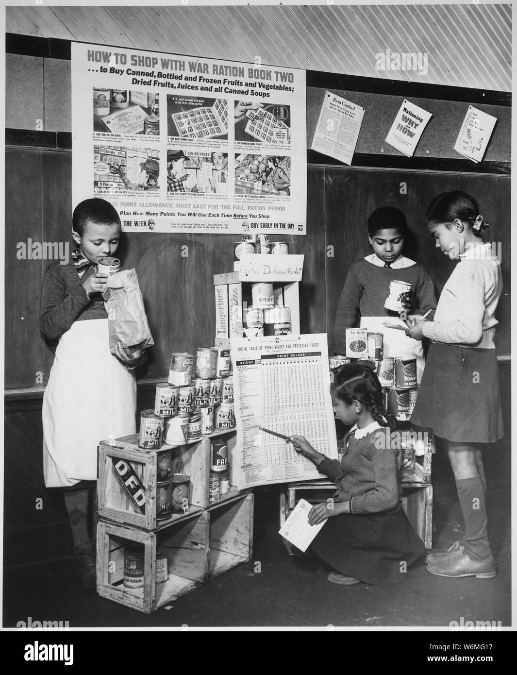 To learn how to shop with point stamps, these youngsters in a Fairfax ...
