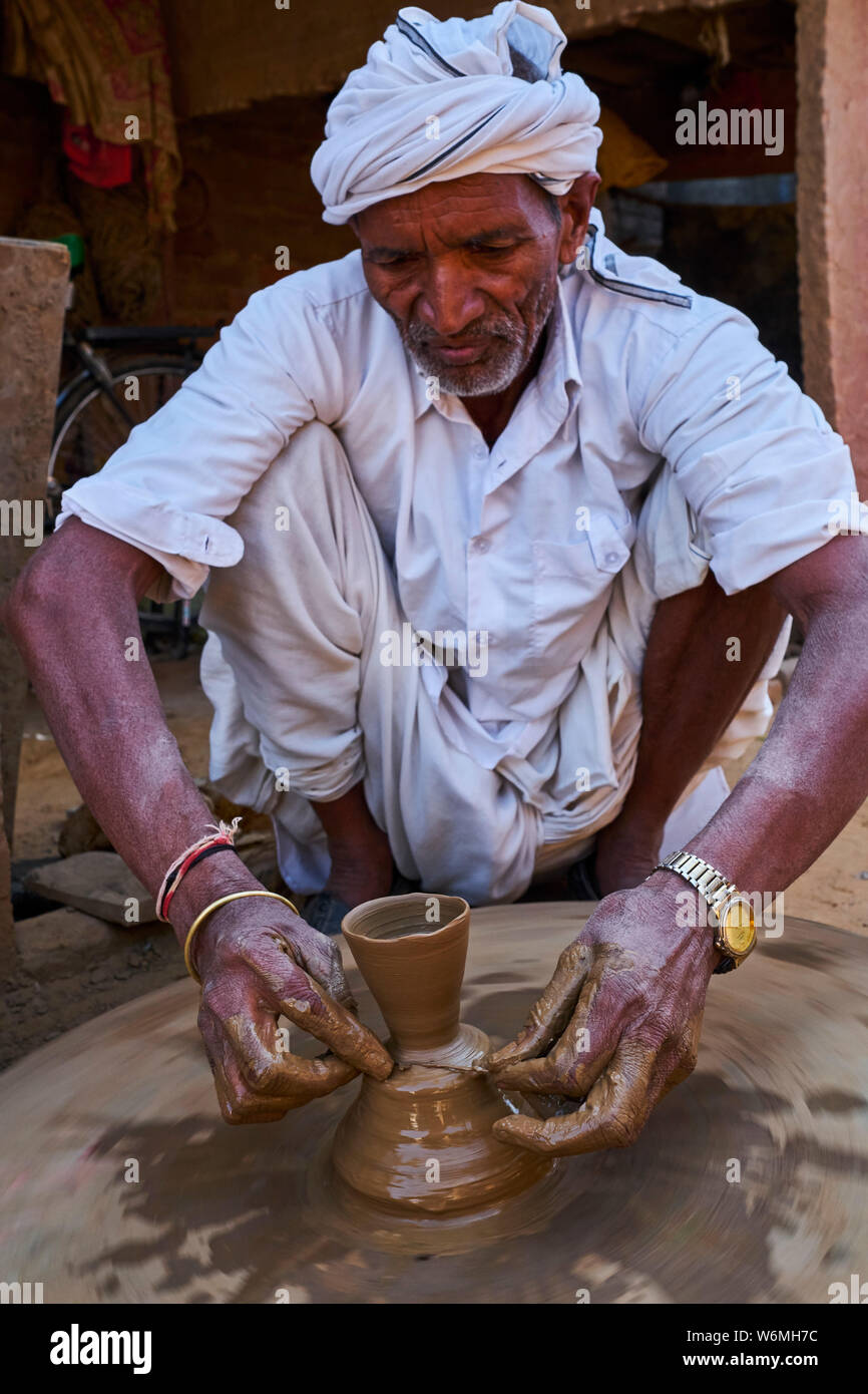 Indian man making pottery hi-res stock photography and images - Alamy