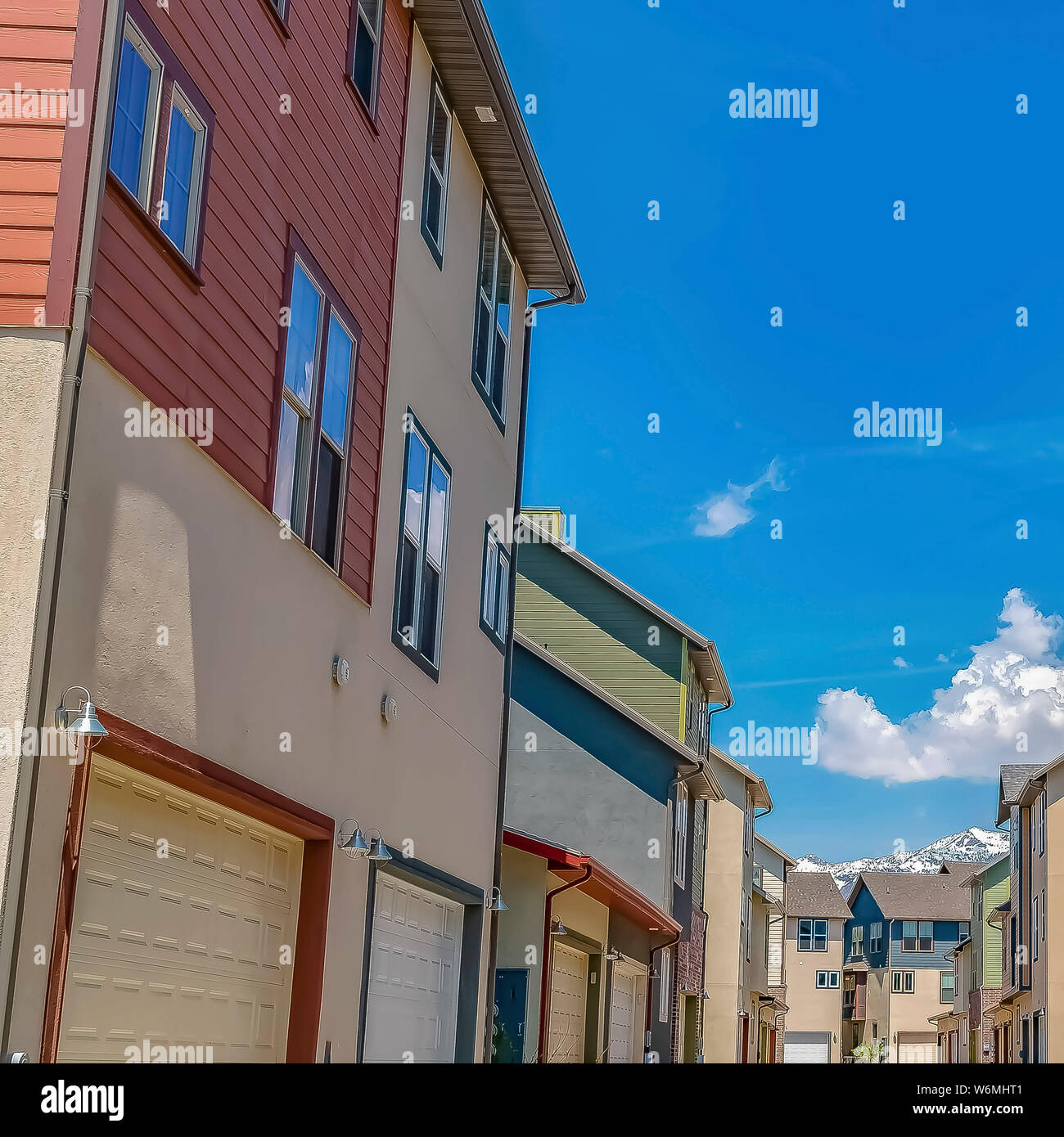 Square Rows of houses with paved road in the middle under blue sky on a ...