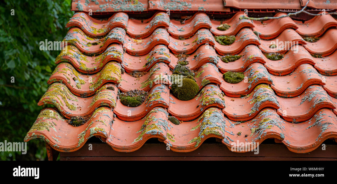 old rooftop restoration, red brick stones on house top Stock Photo - Alamy