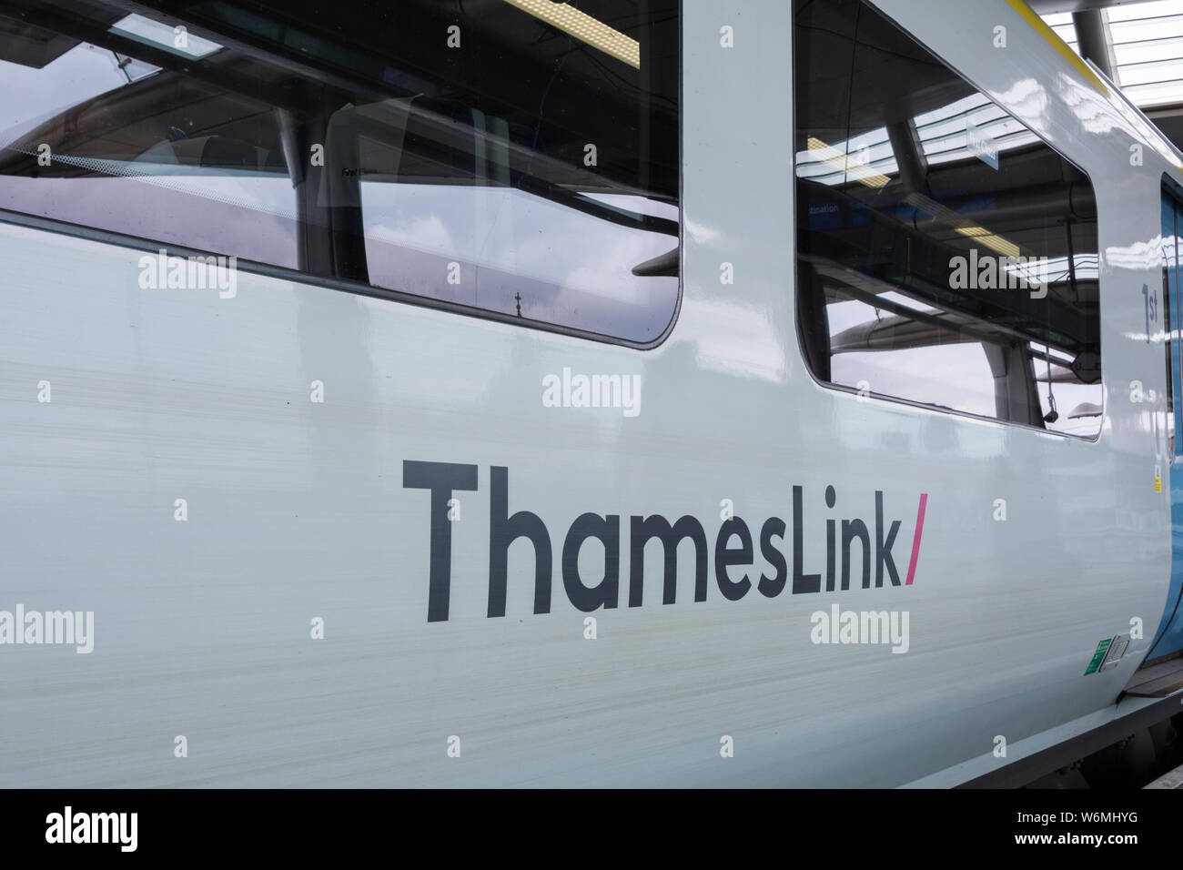 Close-up of a Network Rail Thameslink logo and train carriage at Cannon ...