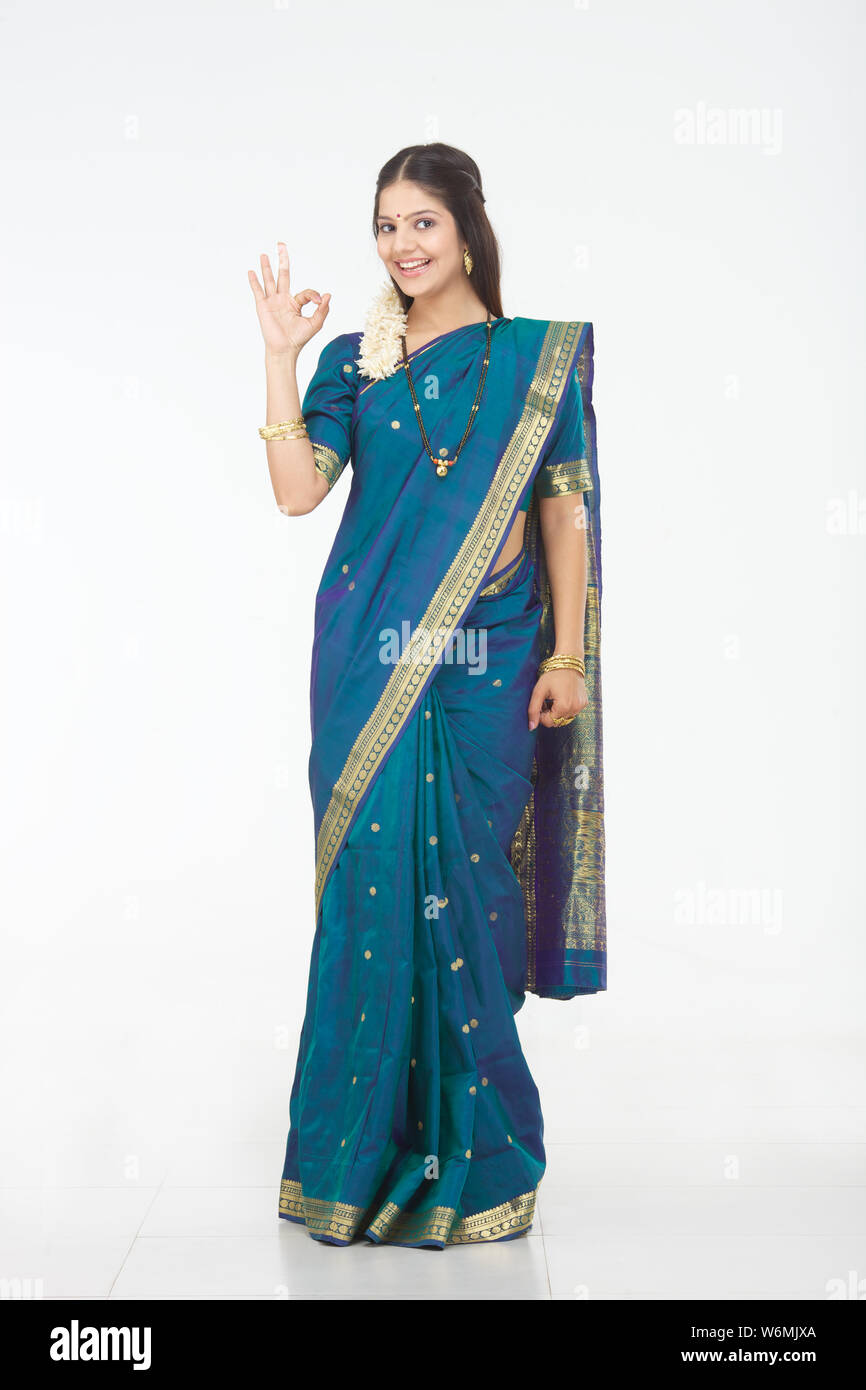 South Indian woman showing ok sign and smiling Stock Photo - Alamy
