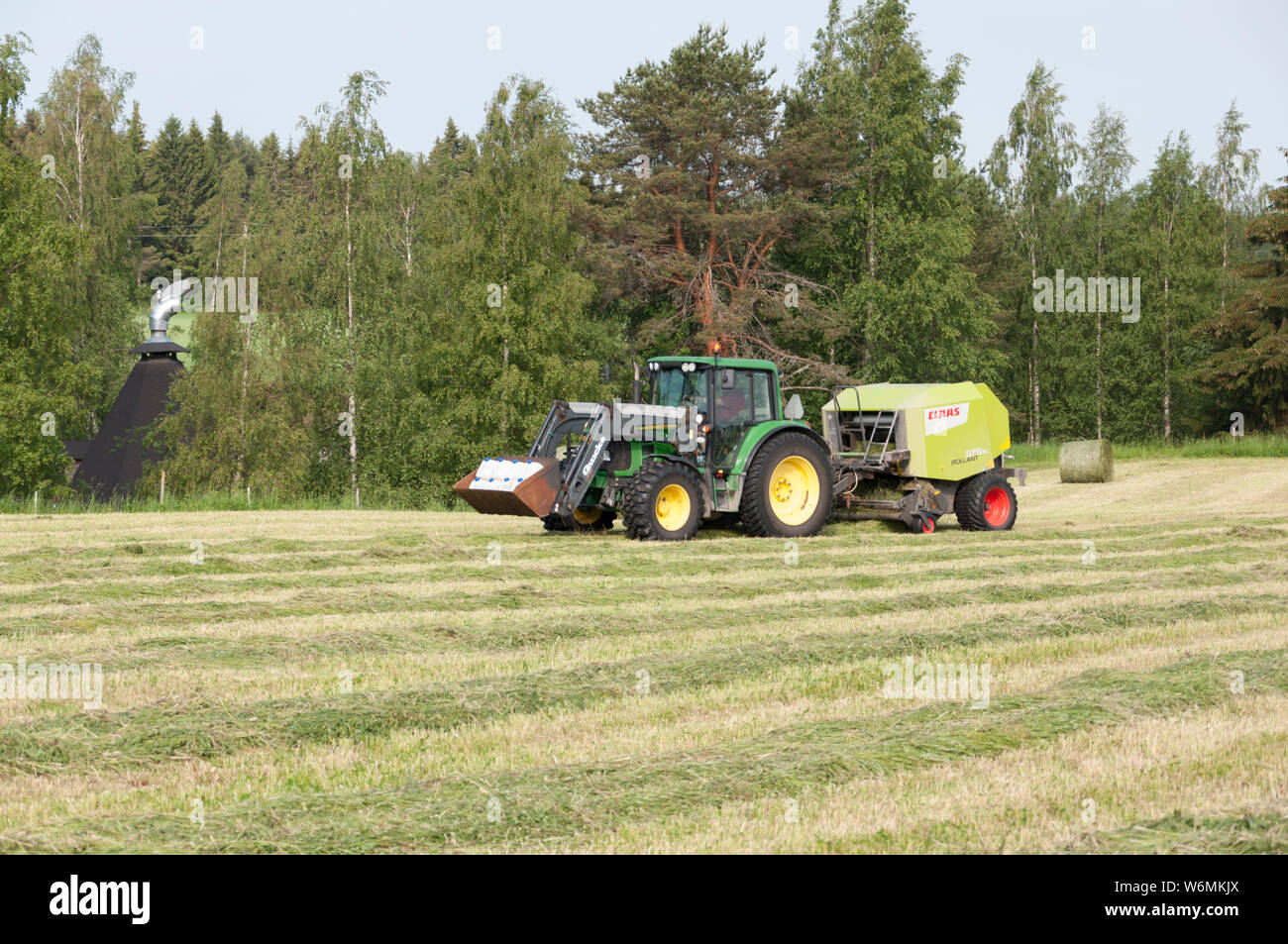 Making round bale Silage in Finland Stock Photo - Alamy