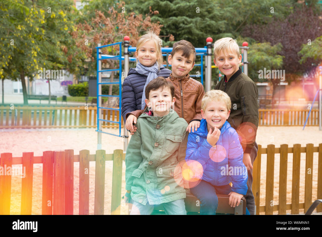 Five little friends posing on the playground Stock Photo - Alamy