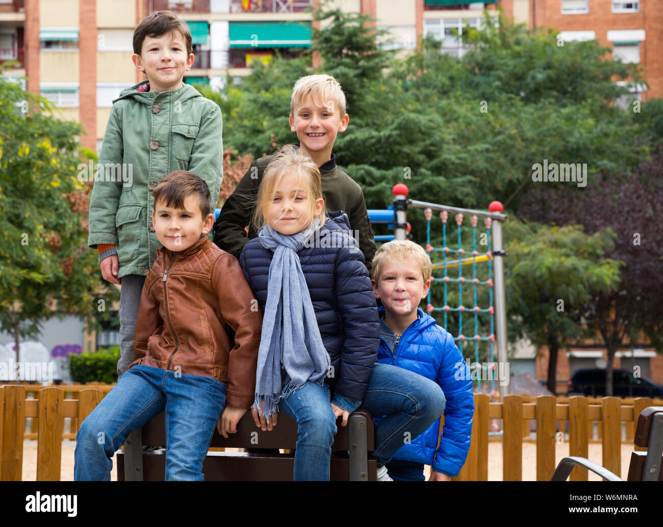 Five little friends posing on the playground Stock Photo - Alamy