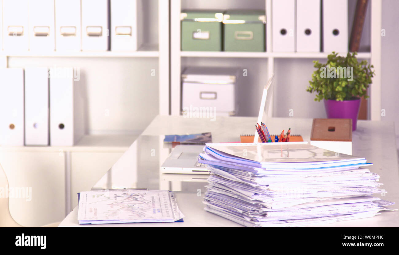 Office table with blank notepad and laptop Stock Photo - Alamy