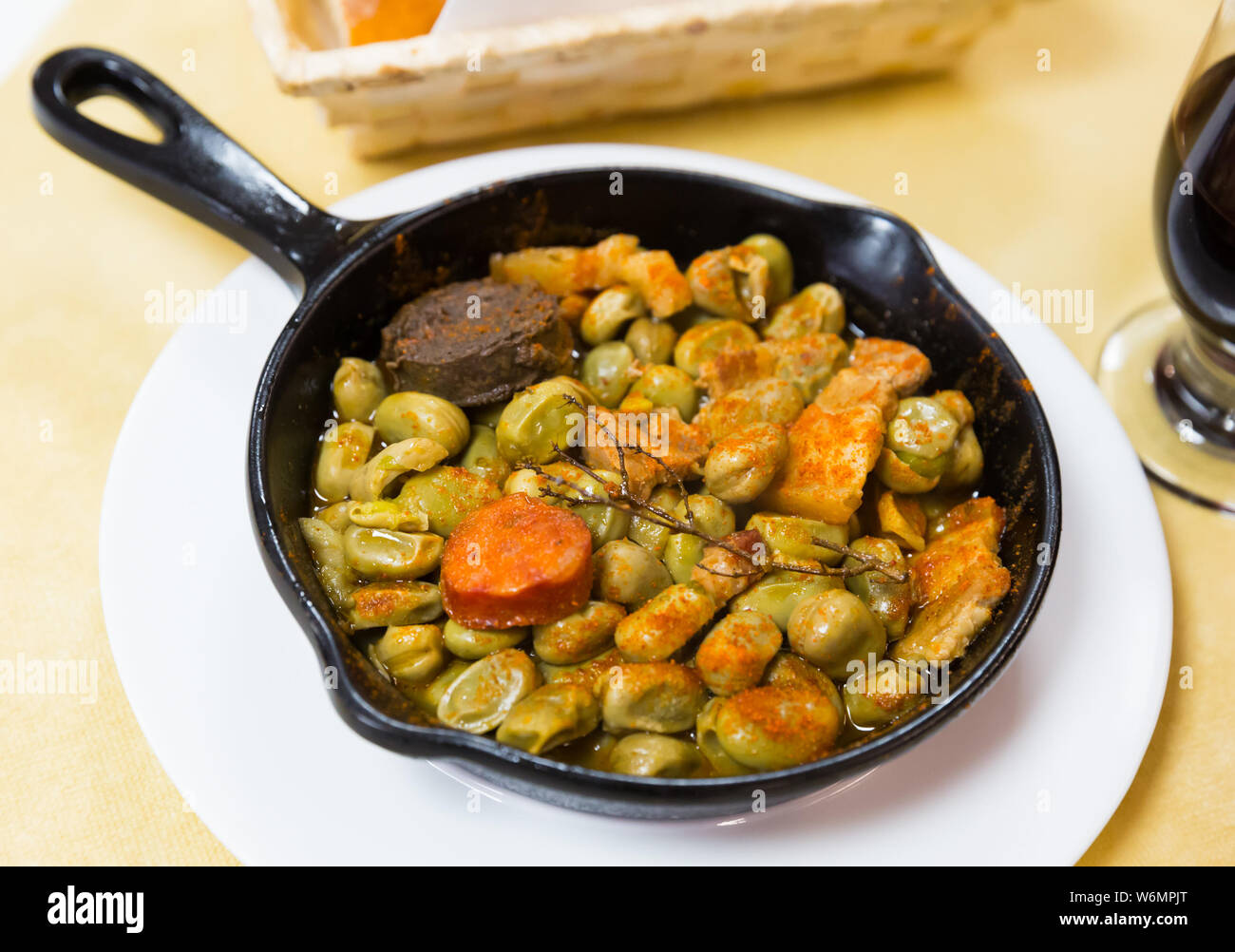 Popular Catalan style beans cooked with sliced blood sausage, chorizo ...
