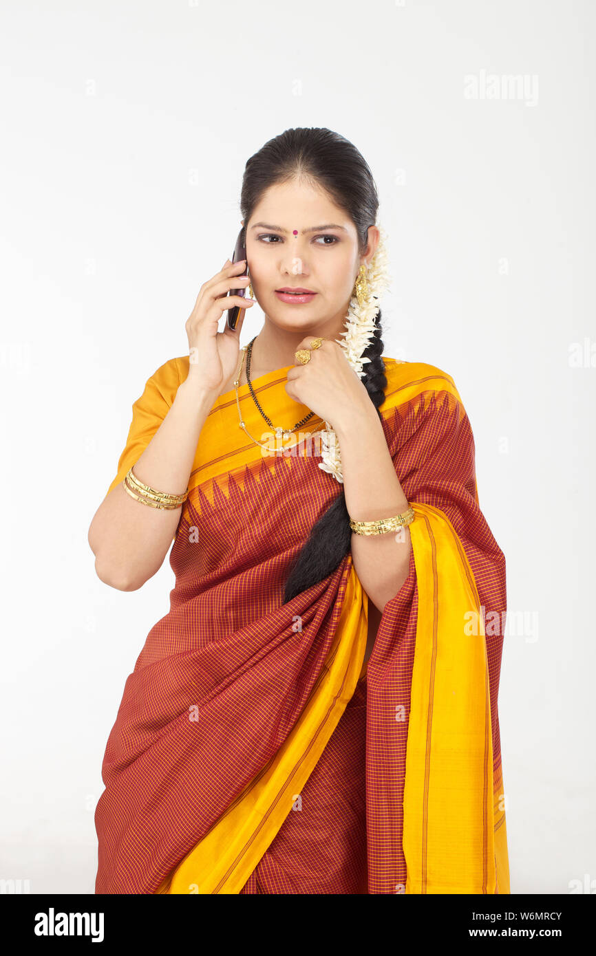 South Indian woman talking on a mobile phone Stock Photo - Alamy