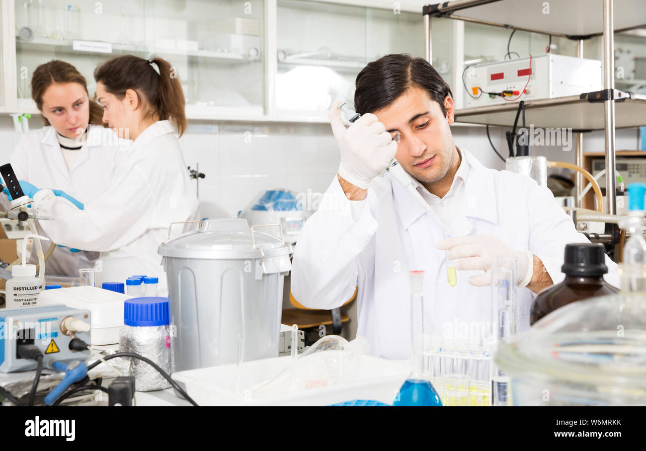 Intelligent student performing experiments in university laboratory ...
