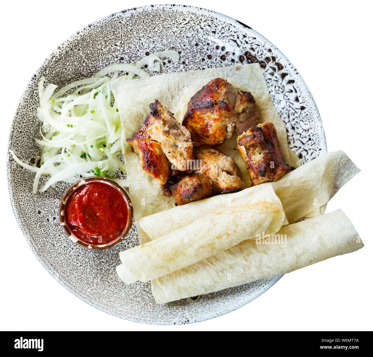 Traditional oriental grilled pork meat shashlik served with flatbread ...