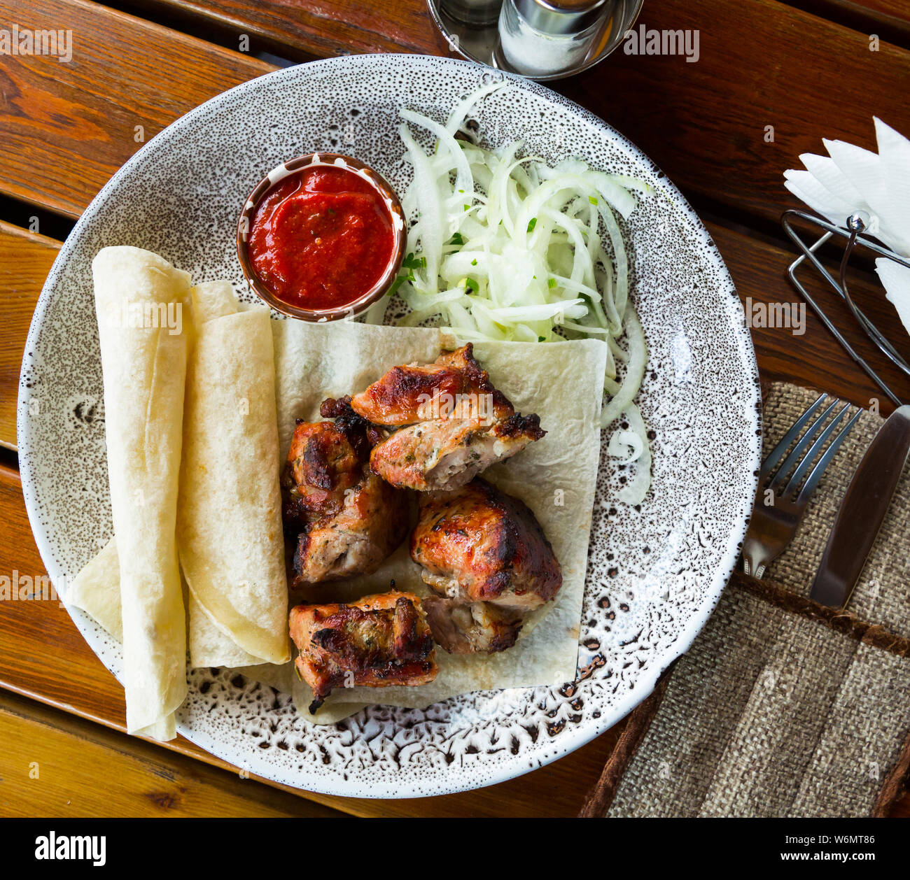 Traditional georgian dish shish kebab or shashlik, grilled pork meat ...