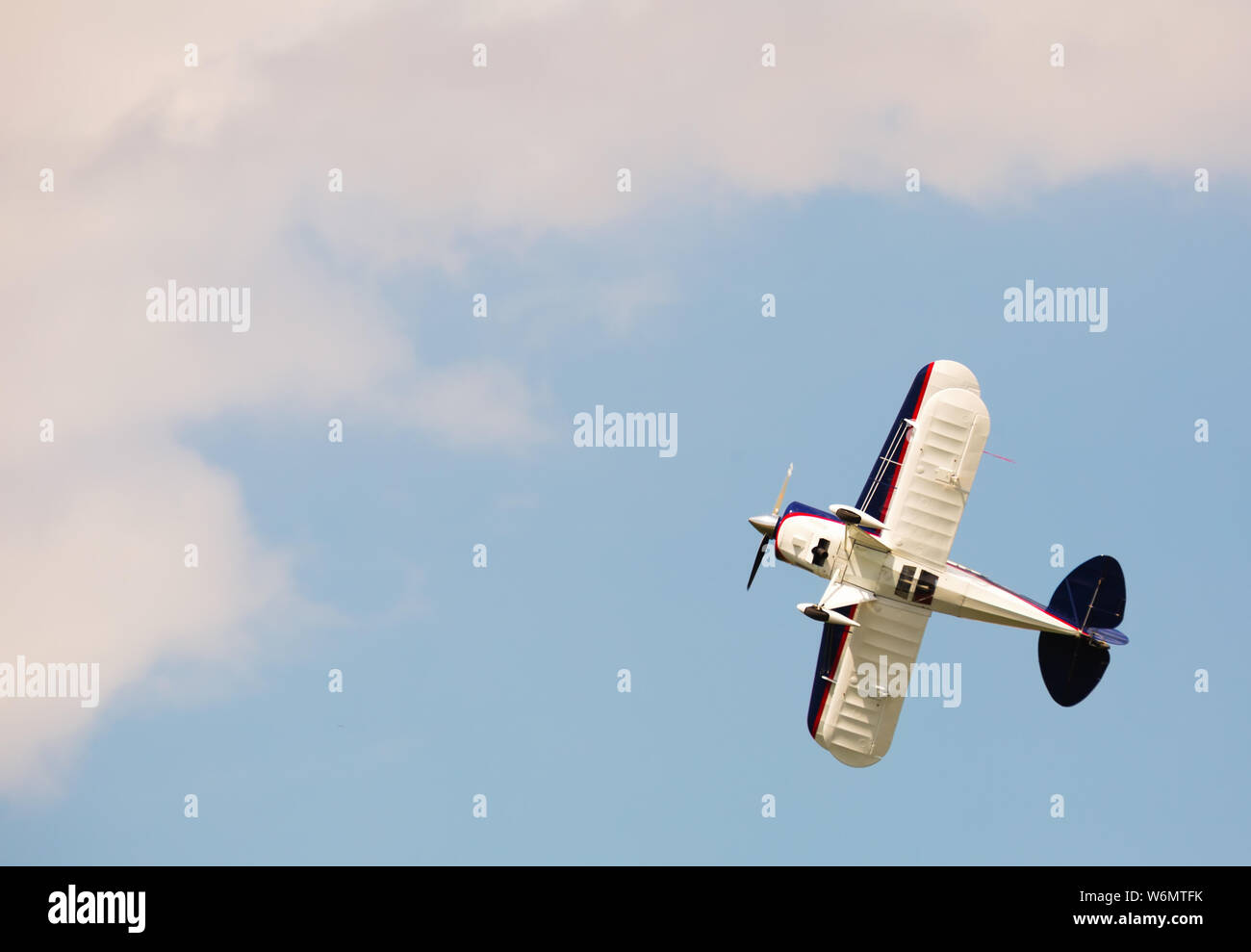 Light biplane demonstrating flying capabilities in sunny sky Stock ...