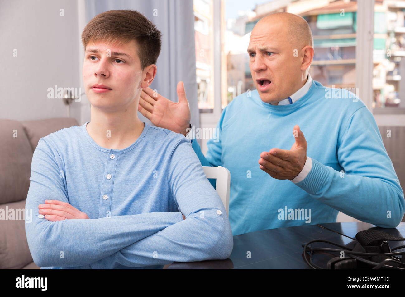 Portrait of angry father quarreling with his teenage son Stock Photo ...