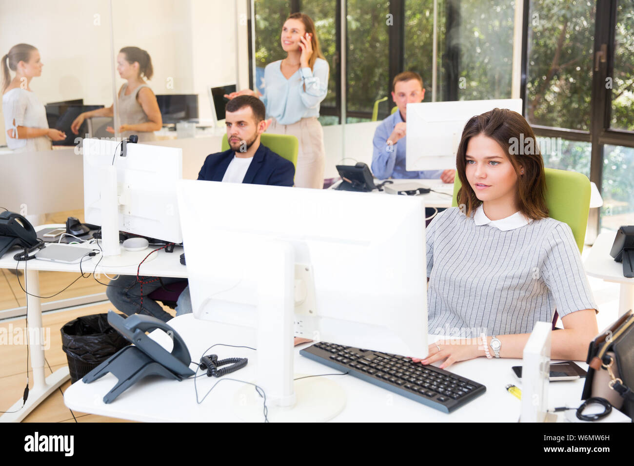 adult positive business people working and communicating together in ...