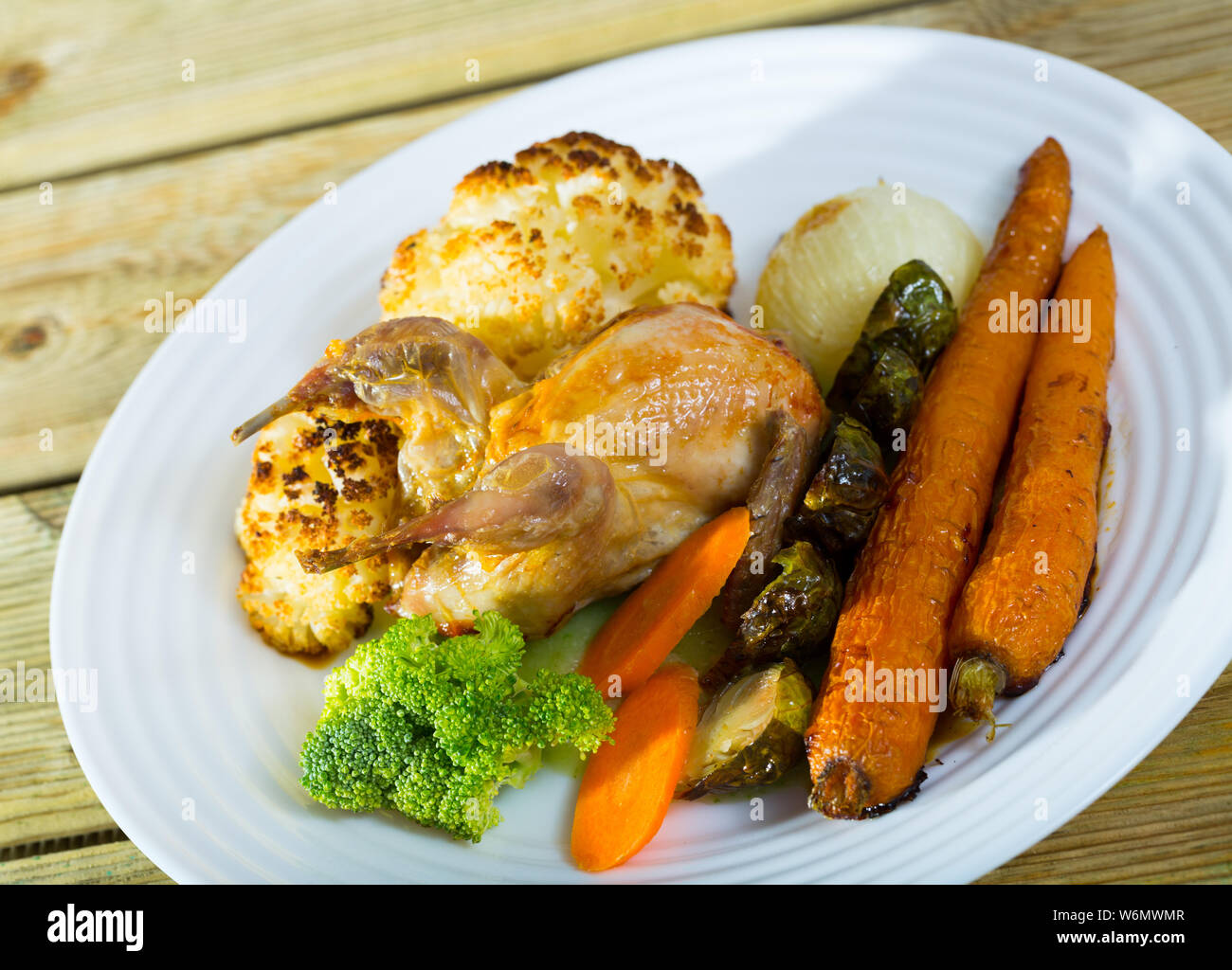 Delicious poultry dish - partridge baked with vegetables in honey ...