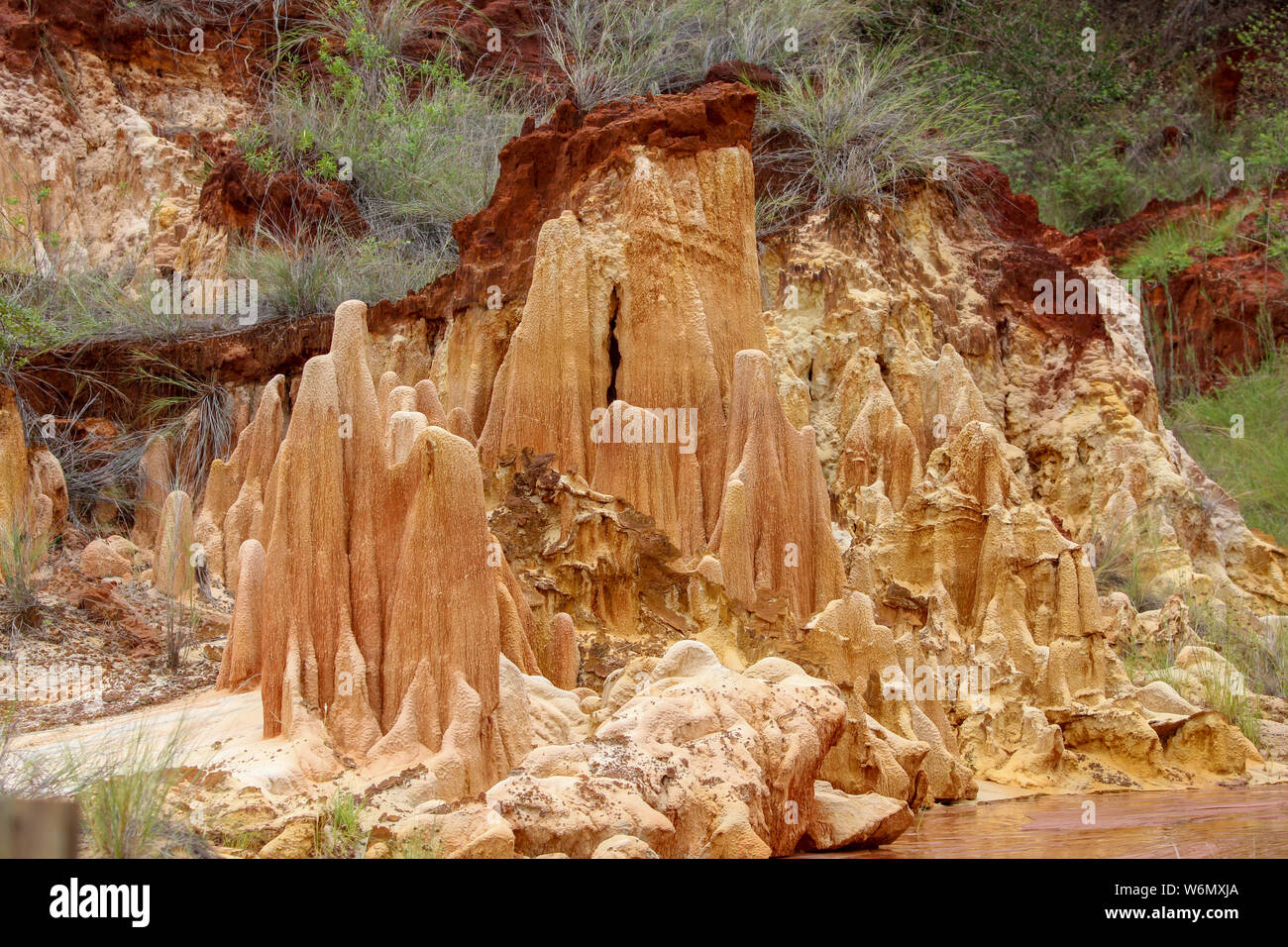 Red sandstone formations and needles (Tsingys) in Tsingy Rouge Park in ...