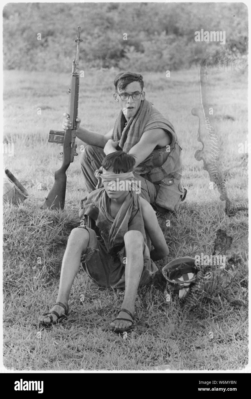 Vietnam....Corporal M.R. Carter guards an NVA soldier he captured ...