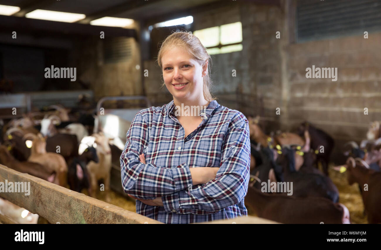 Positive woman owner of dairy farm Stock Photo - Alamy