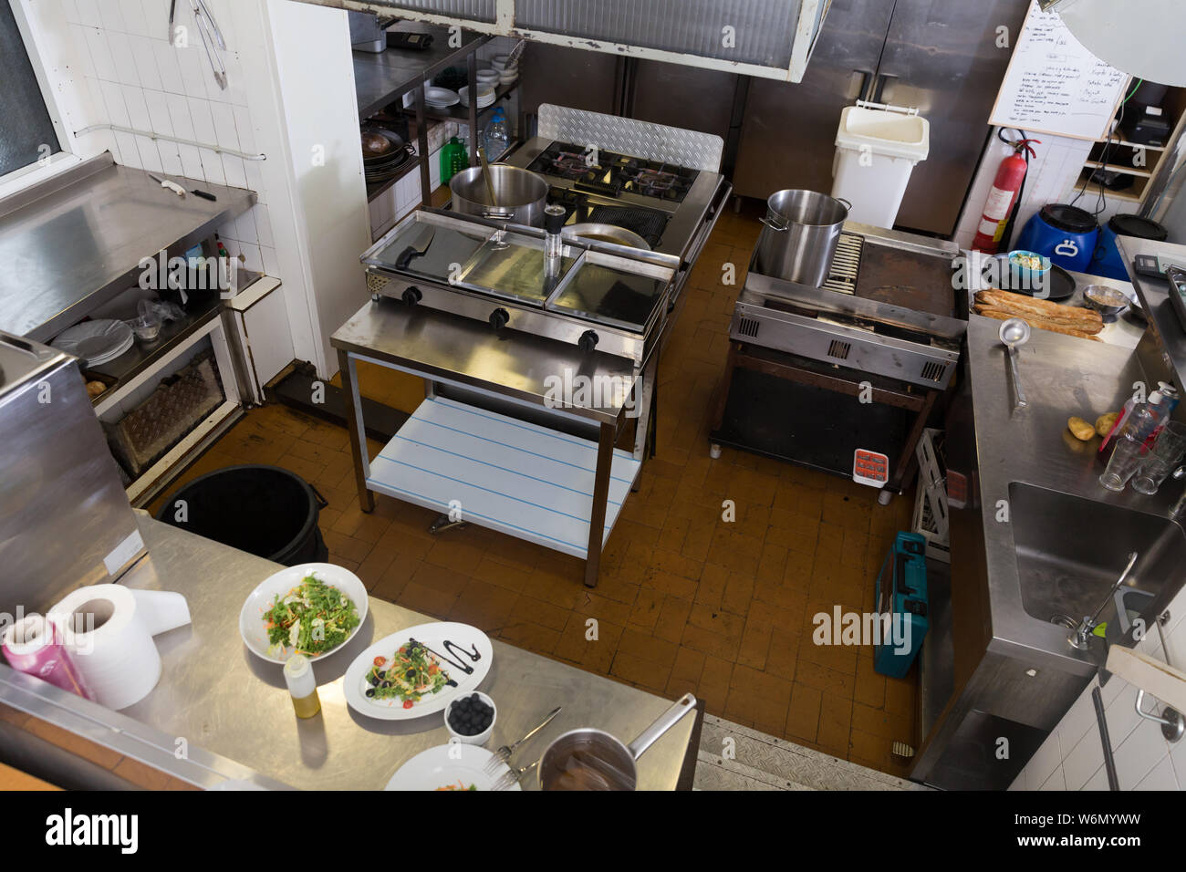 View of empty restaurant kitchen with professional equipment and ...
