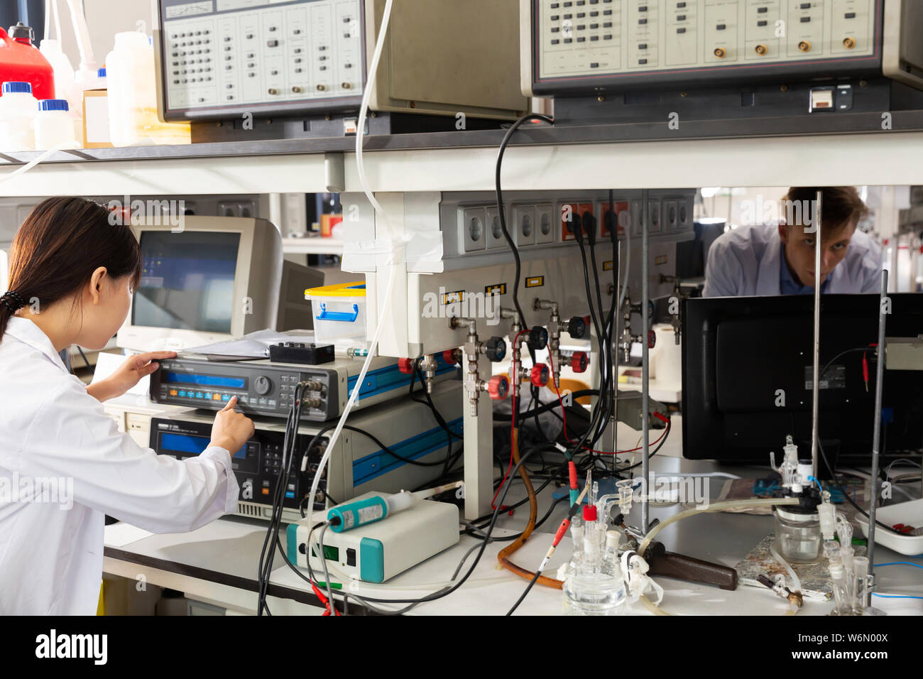 Concentrated international student using hi-res stock photography and ...