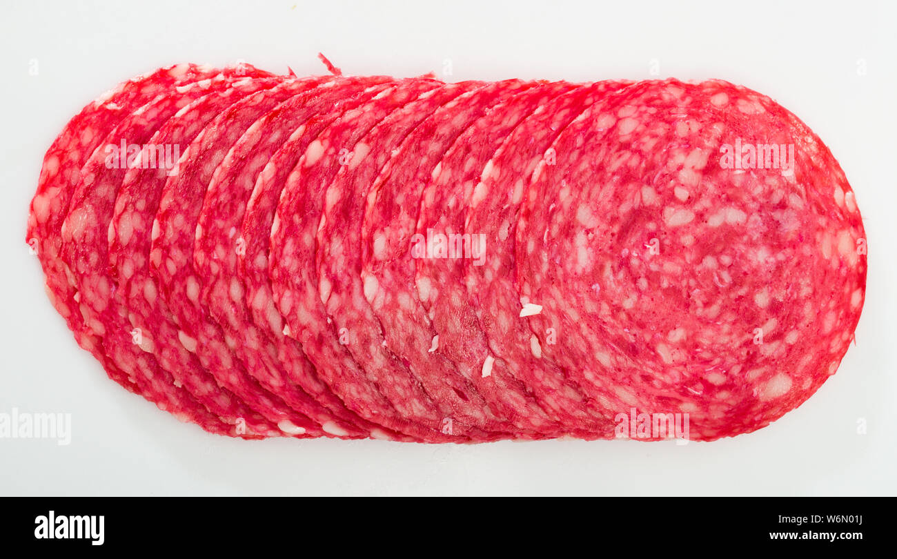 Traditional Spanish salami sausage slices on white background Stock ...