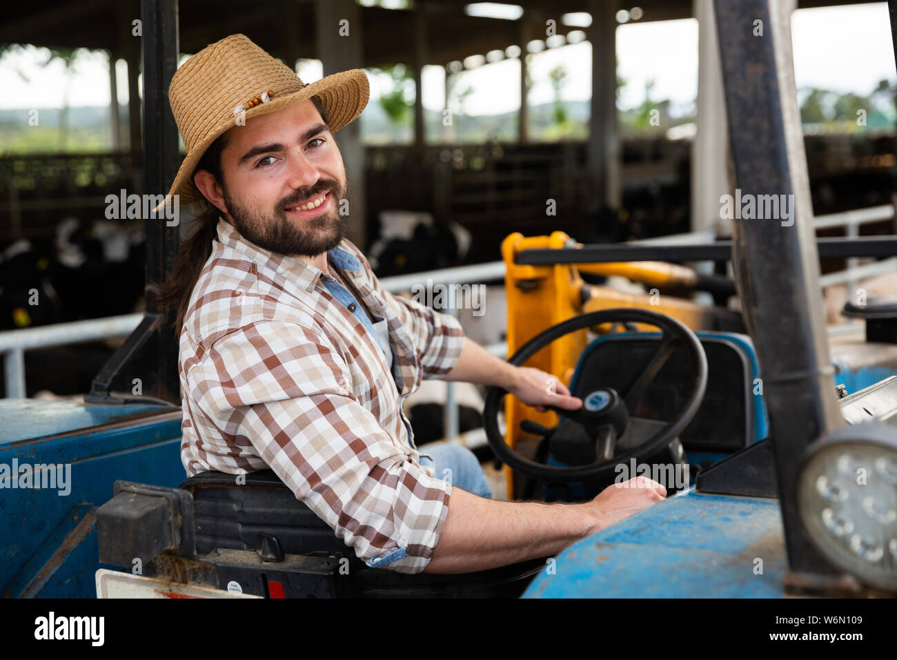 Young man sitting on tractor hi-res stock photography and images - Alamy