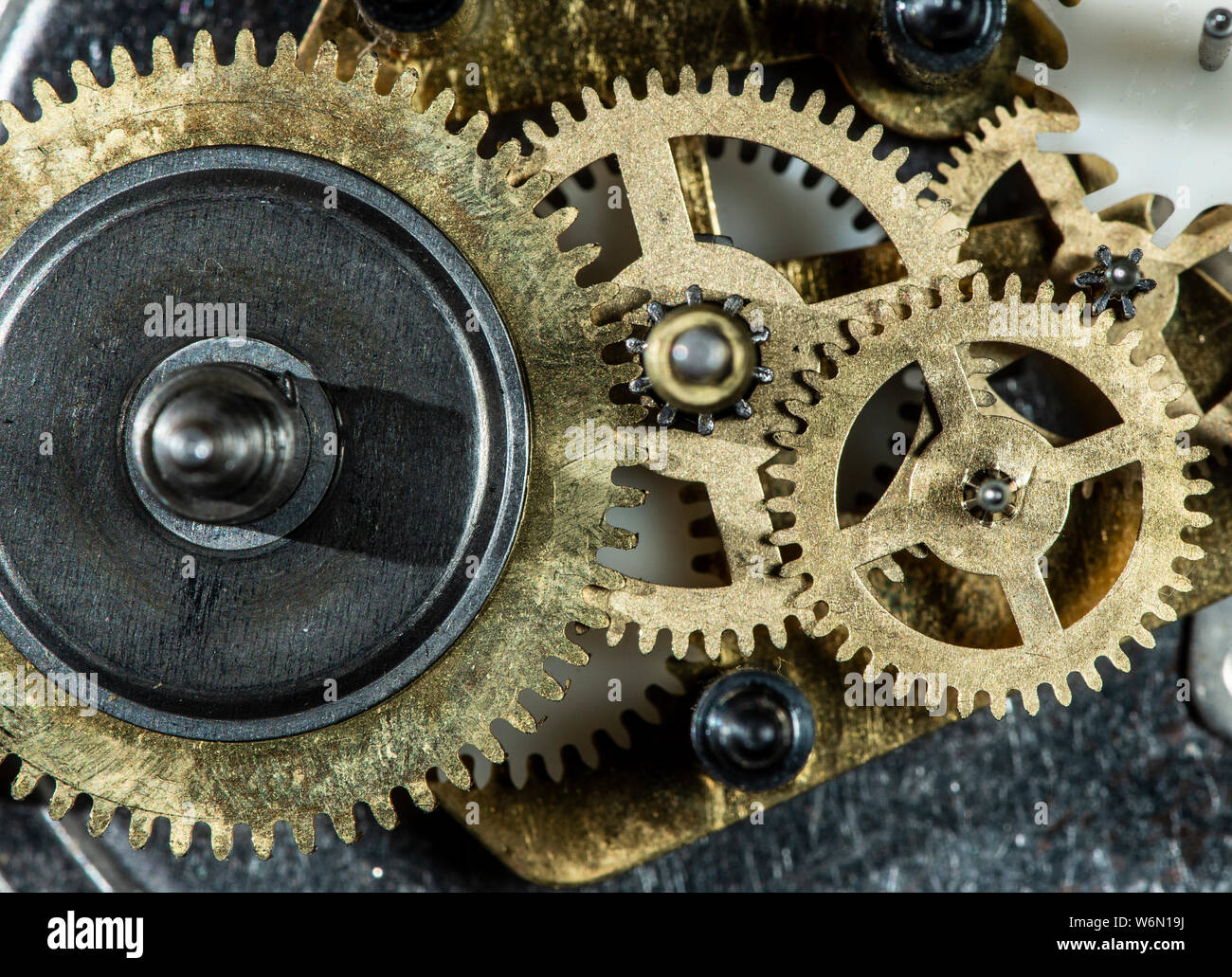 Close up metal gears mechanism. Golden colours. Hard light. Clock ...