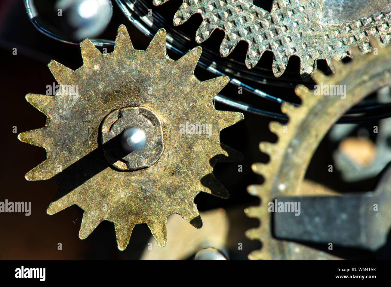 Close up metal gears mechanism. Golden colours. Hard light. Clock ...