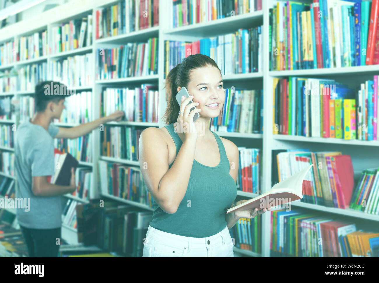 Talking to customer in book store hi-res stock photography and images ...