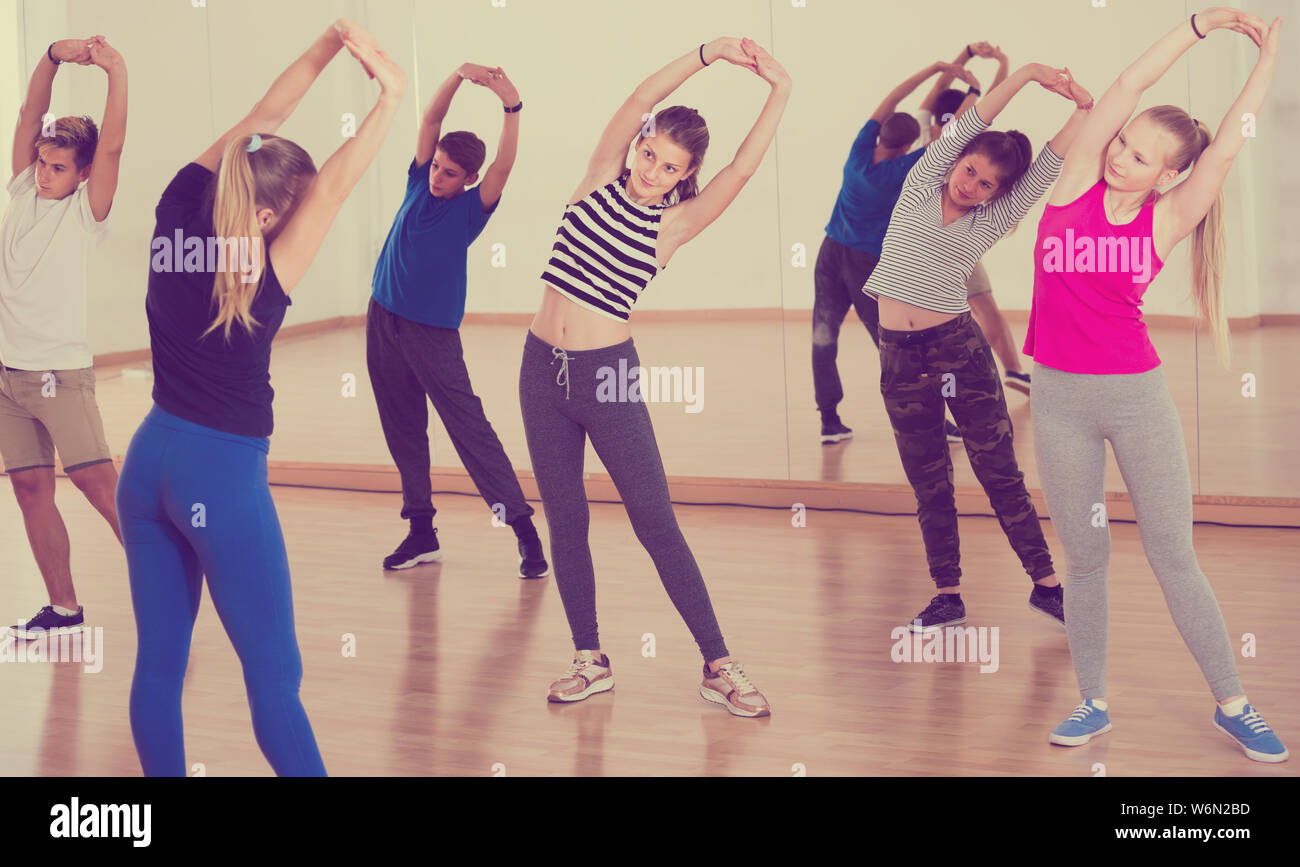Pupils exercising in dance hall Stock Photo - Alamy