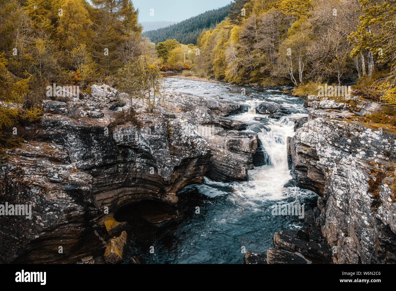 River Morison Falls at Invermoriston in Scotland surrounded by woodland ...