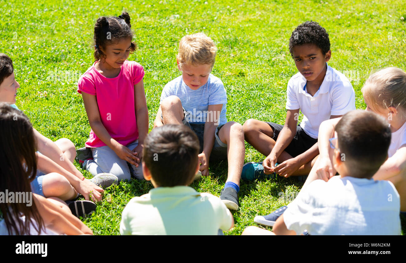 Excited children talking with friends hi-res stock photography and ...