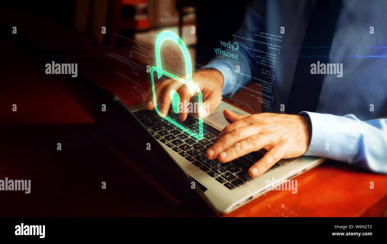Man typing on laptop with padlock hologram screen over keyboard. Cyber ...