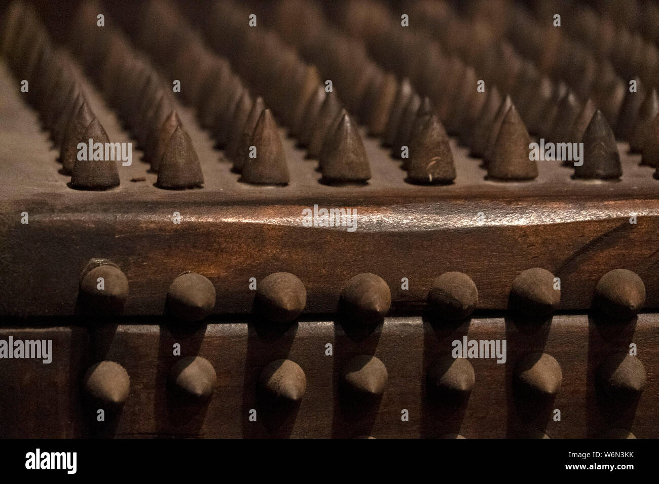 Torture iron spikes medieval chair detail Stock Photo - Alamy
