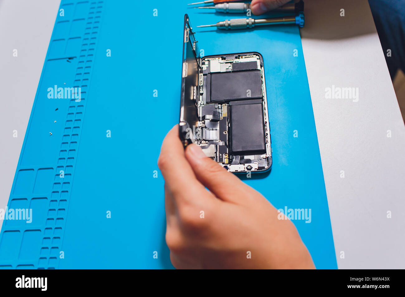 Close-up photos showing process of mobile phone repair Stock Photo - Alamy