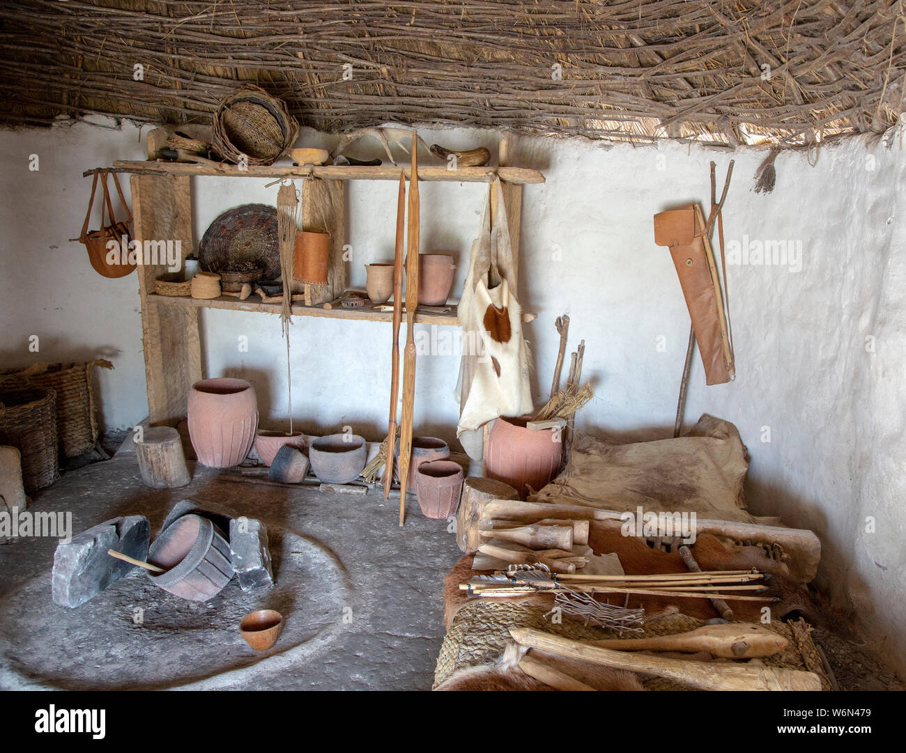 Re-creation of neolithic home, contents, weapons, tools, Stonehenge ...