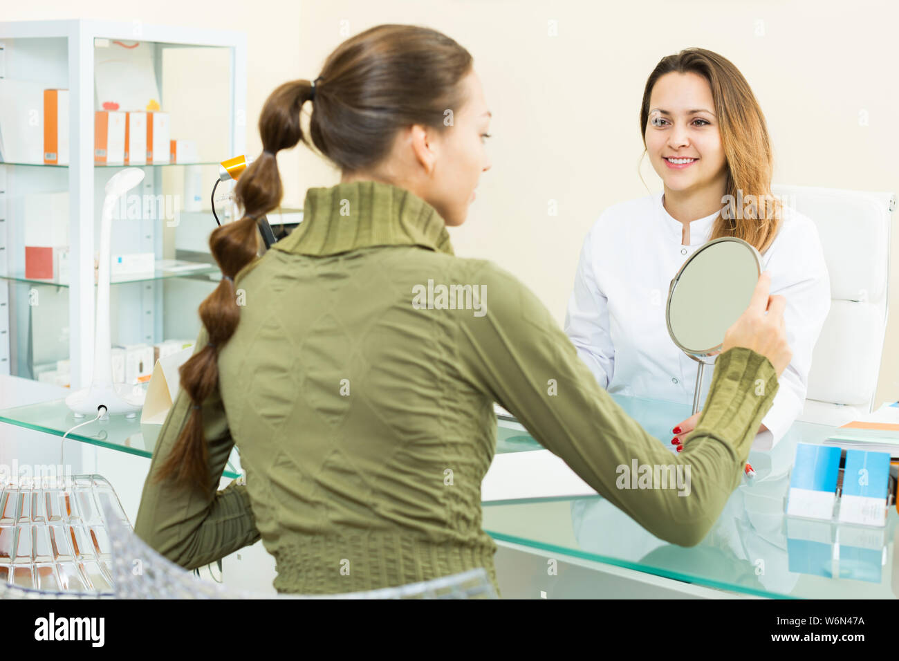 Young female client visiting consultation at a aesthetic medicine ...