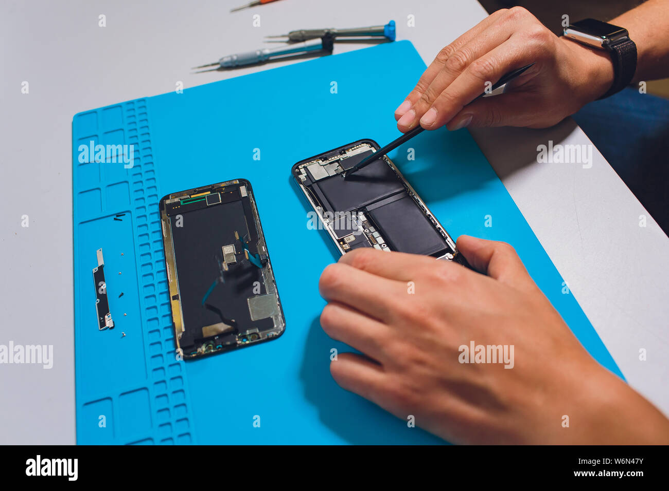 Close-up photos showing process of mobile phone repair Stock Photo - Alamy