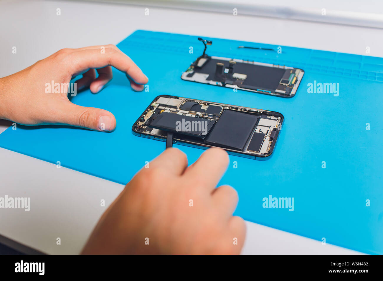 Close-up photos showing process of mobile phone repair Stock Photo - Alamy
