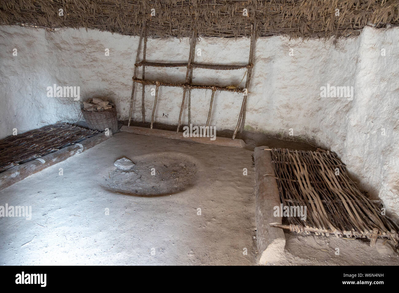 Re-creation of neolithic home, contents, furniture, beds, Stonehenge ...