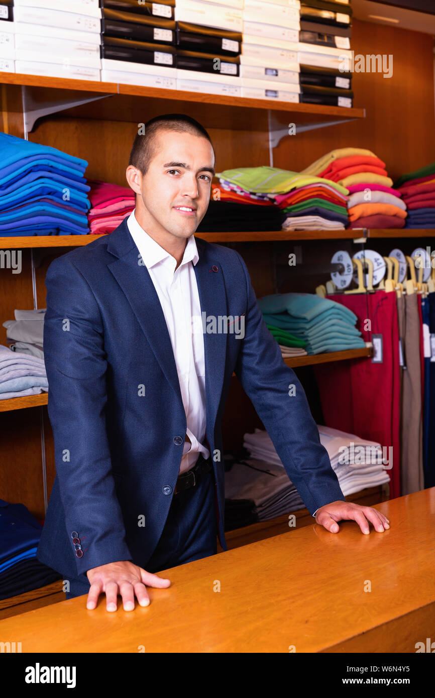 Smiling glad cheerful positive successful male administrator of ...