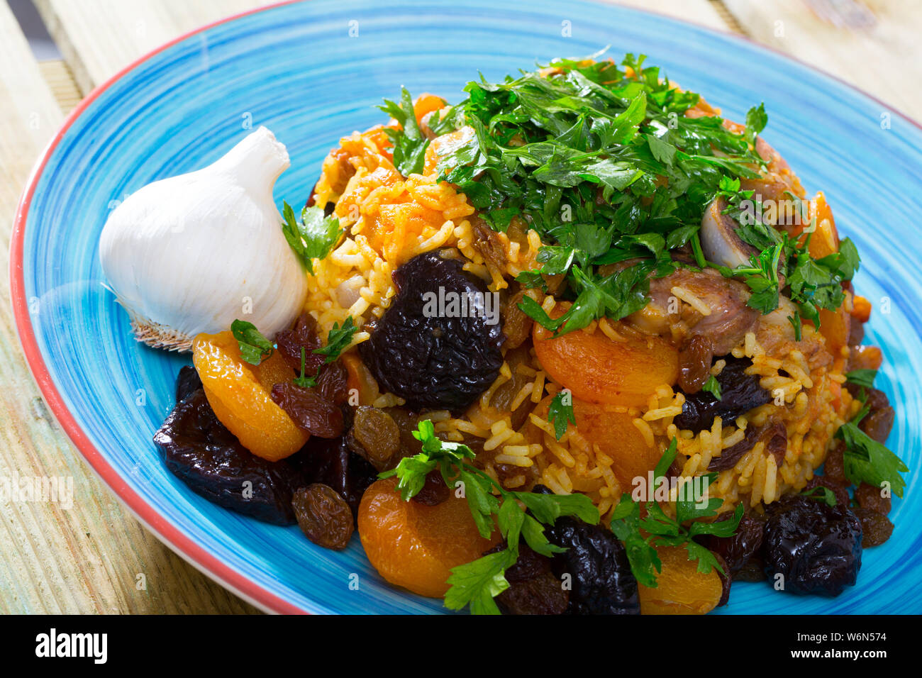 Rice pilaf with mutton, dried apricots, prunes, garlic and herbs Stock ...