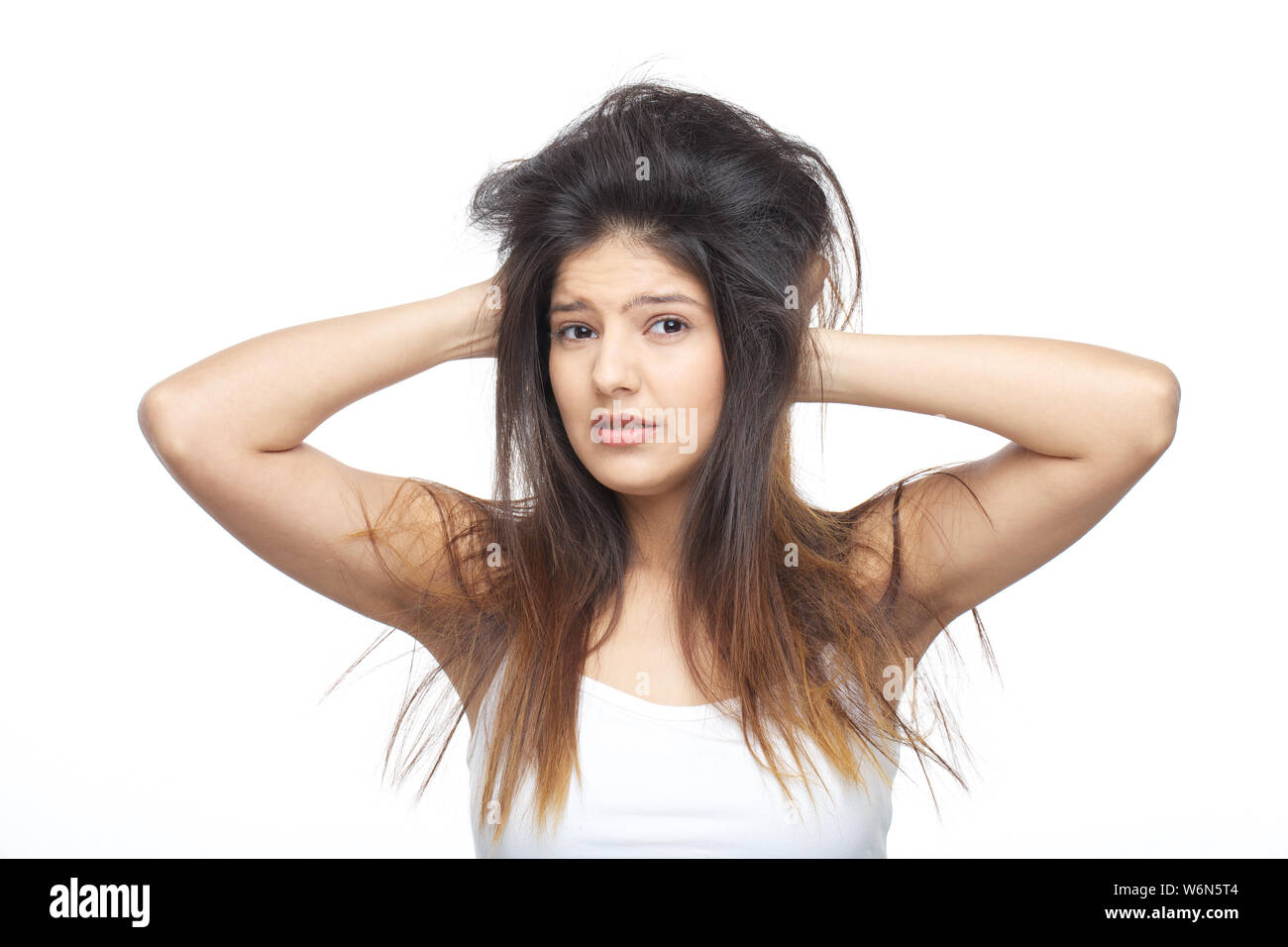 Portrait of a woman pulling her hair Stock Photo - Alamy